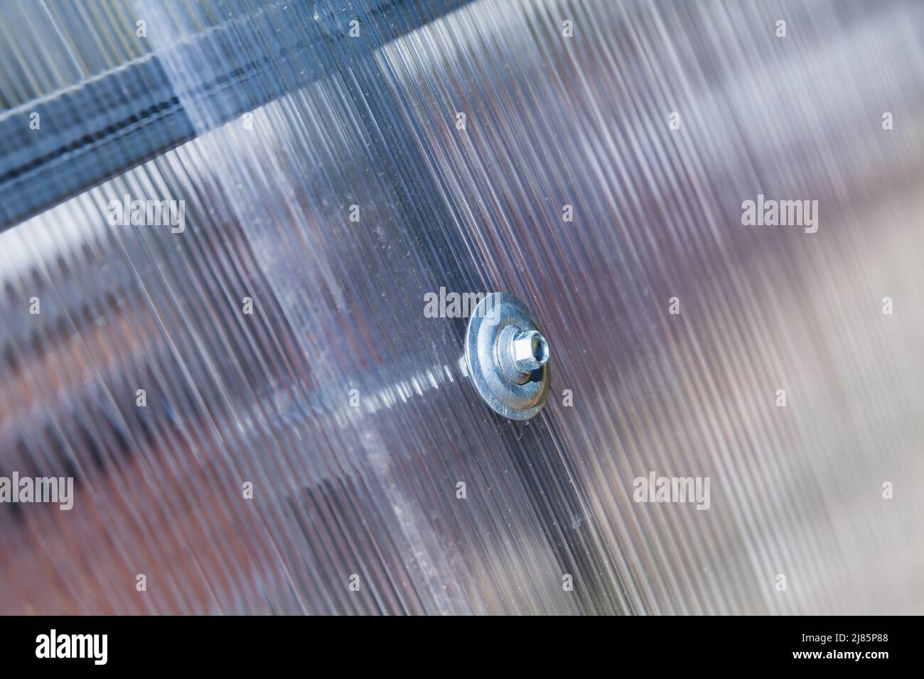 Modern greenhouse details. Connection of polycarbonate roof with steel ...