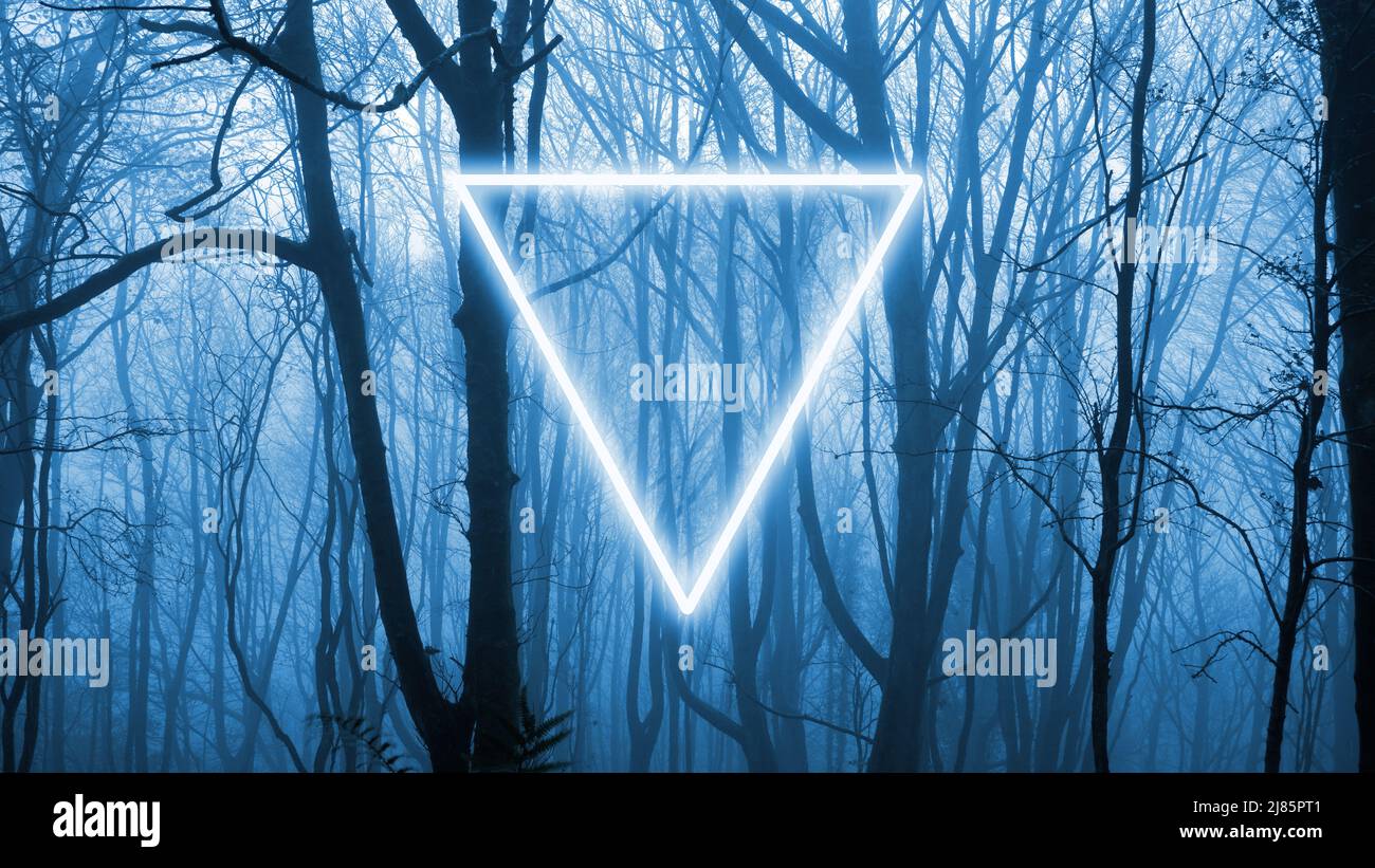 A magical triangle portal. Glowing and floating In a mysterious, foggy ...