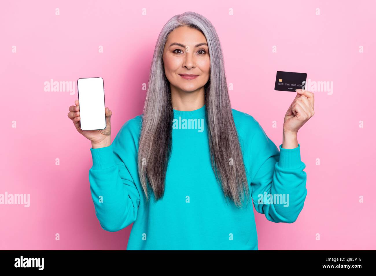 Photo of nice friendly lady hold show empty space display debit card ...