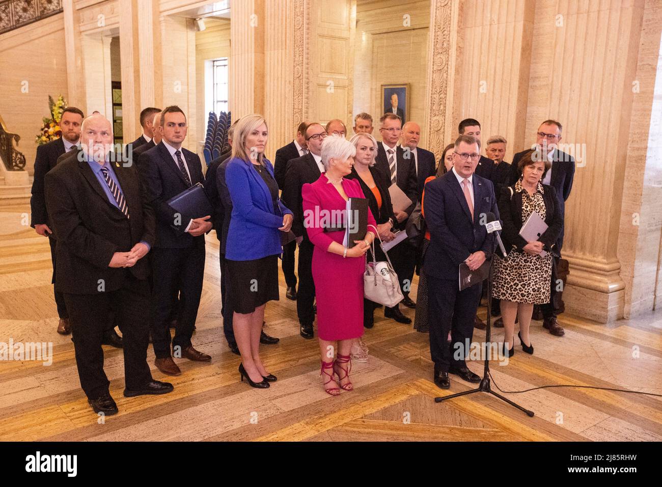 DUP Leader Sir Jeffrey Donaldson with party colleagues, speaking at the ...