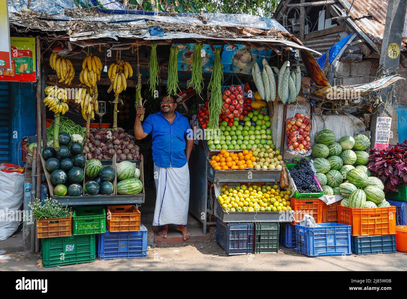 Owner standing in the doorway of his fruit and vegetable shop in ...