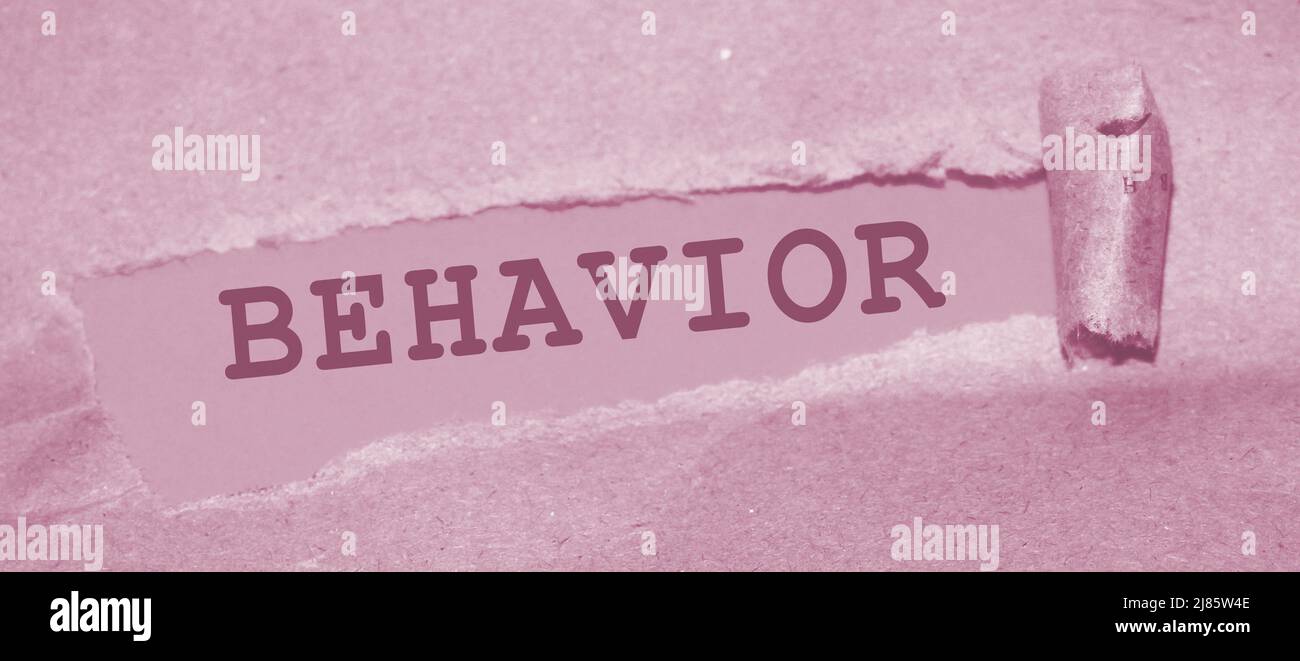 Behavior word written under brown torn paper Stock Photo - Alamy