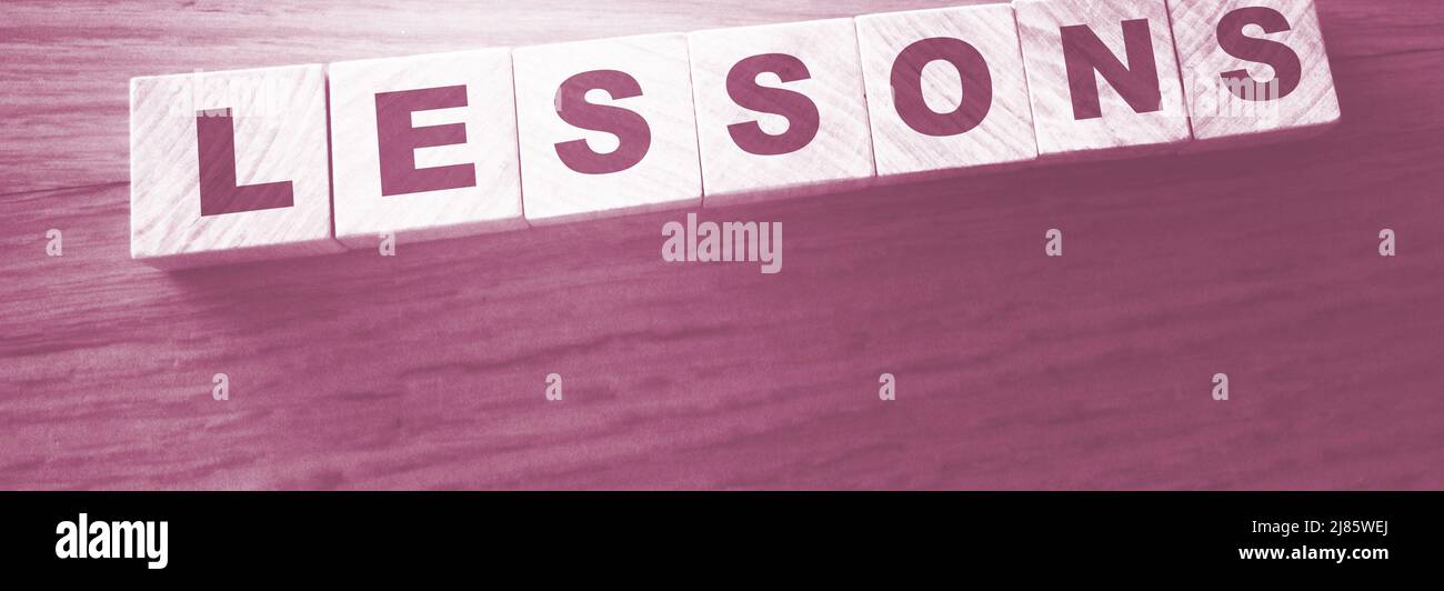 Lessons Word Written In Wooden Cubes. Learning concept Stock Photo - Alamy