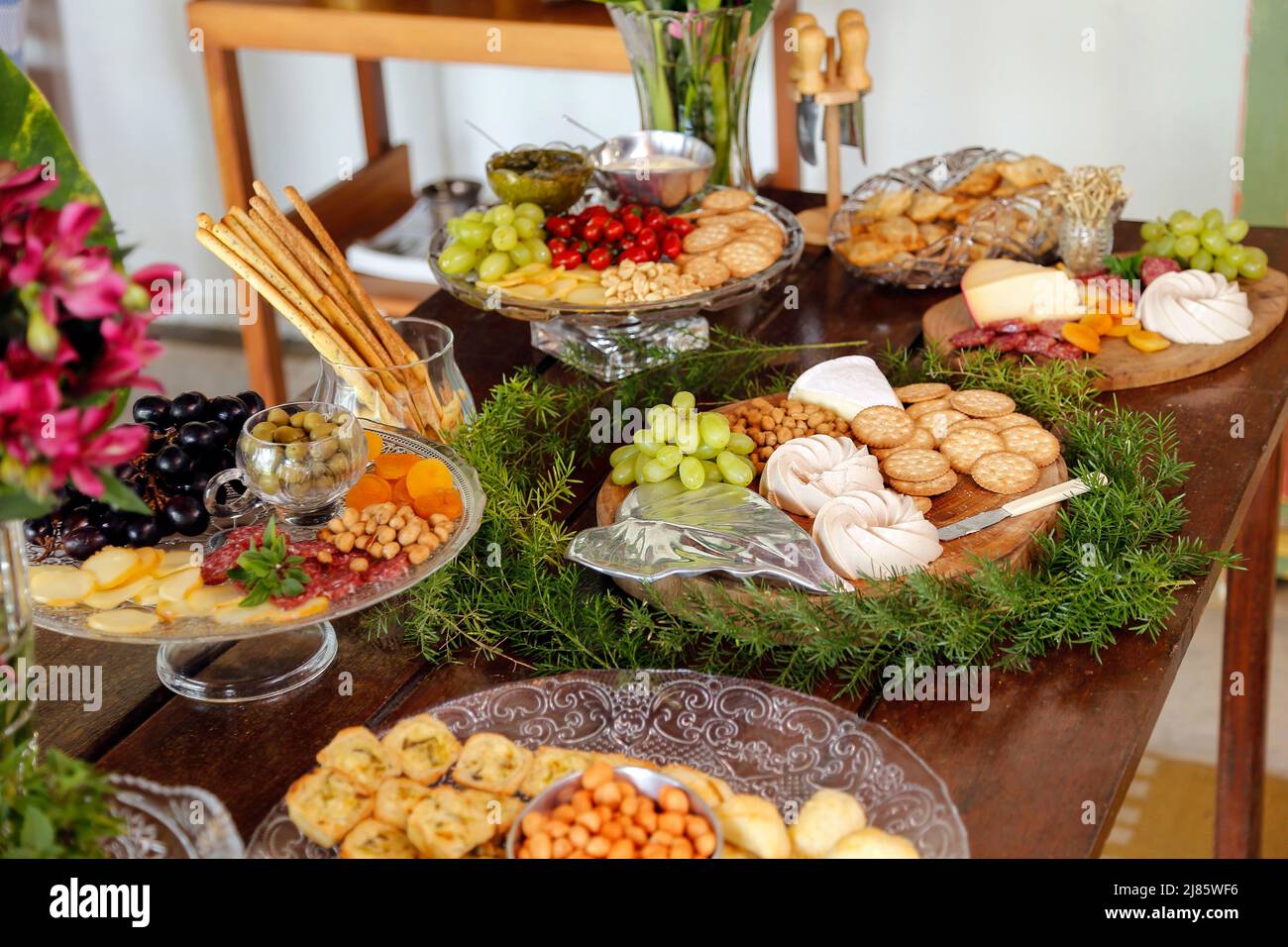 buffet served with various savory foods at a party - snacks board Stock ...