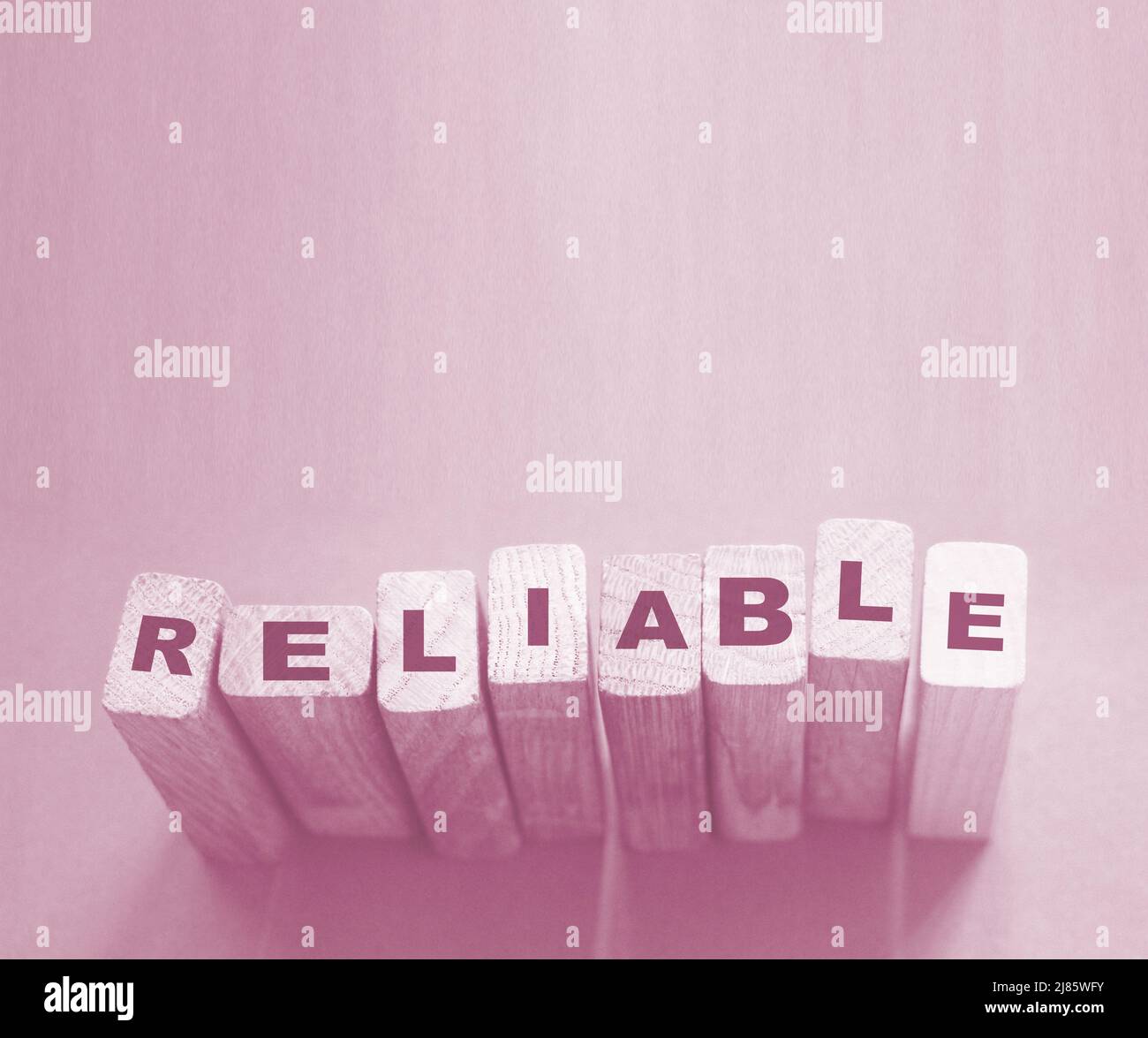 Reliable word on a wooden blocks. Trust worthy conept Stock Photo - Alamy