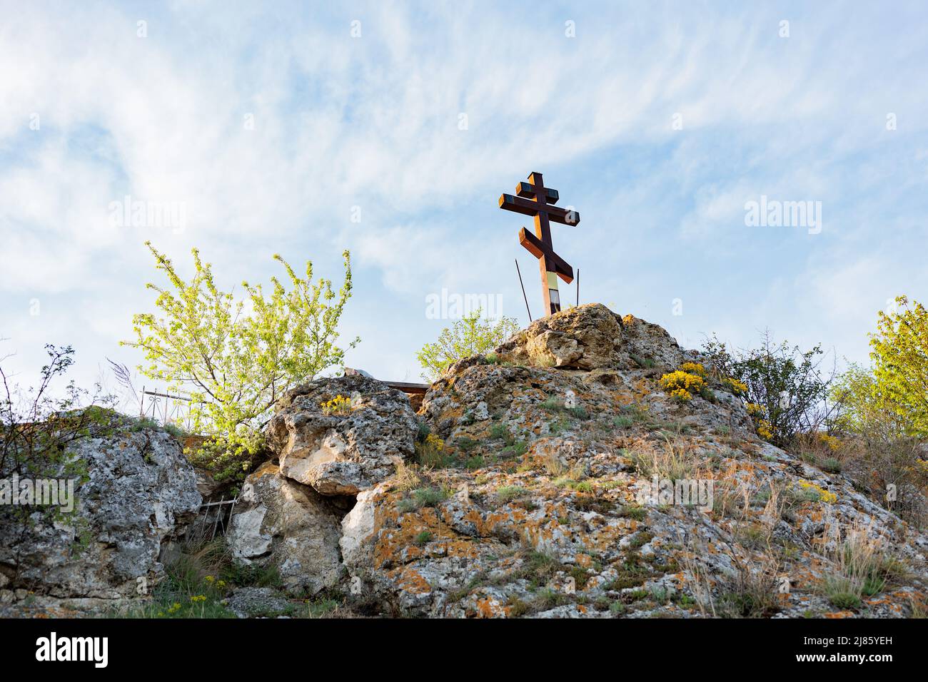 Wooden cross on rock top hi-res stock photography and images - Alamy