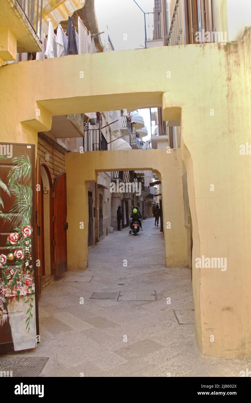 Narrow passageway with series of buttresses between buildings in the ...