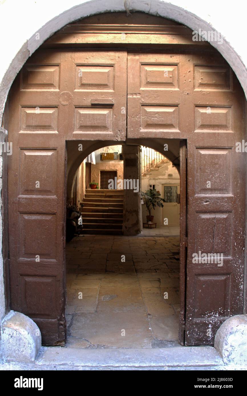 Bari, Italy. Access door to an inner courtyard of a residential ...