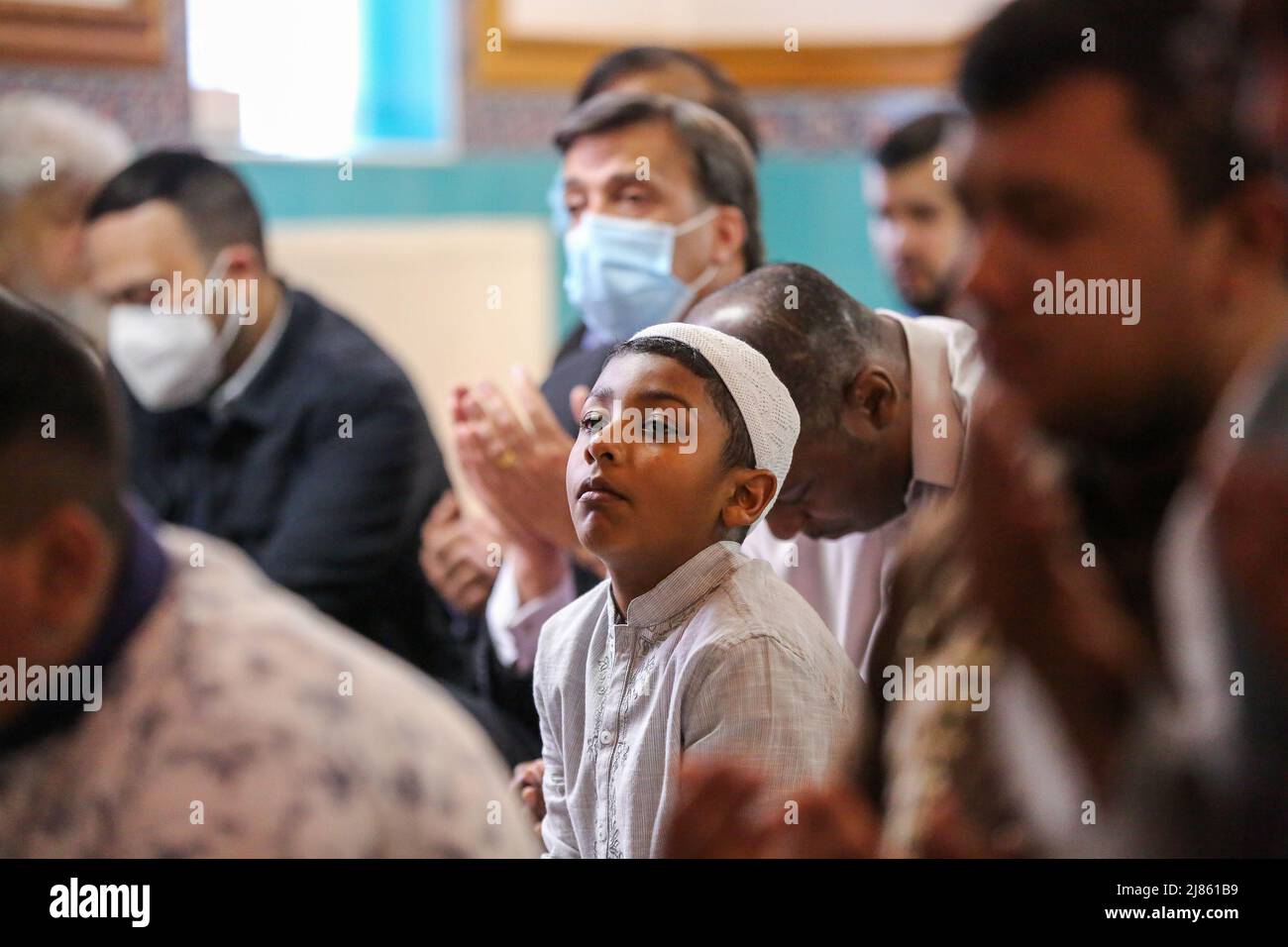 A Muslim kid attends morning prayers at a mosque Stock Photo - Alamy