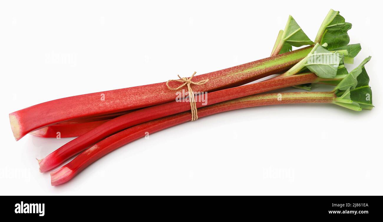 Fresh rhubarb stem and leaves over white background Stock Photo - Alamy