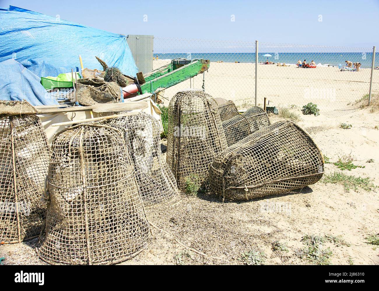 Cages and fishing gear on the beach of Castelldefels, Barcelona ...