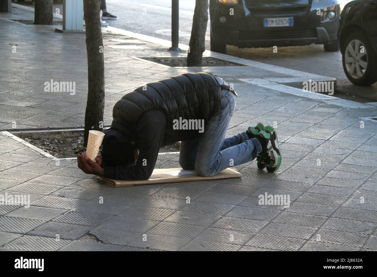 Man begging on a street in Bari, Italy Stock Photo - Alamy
