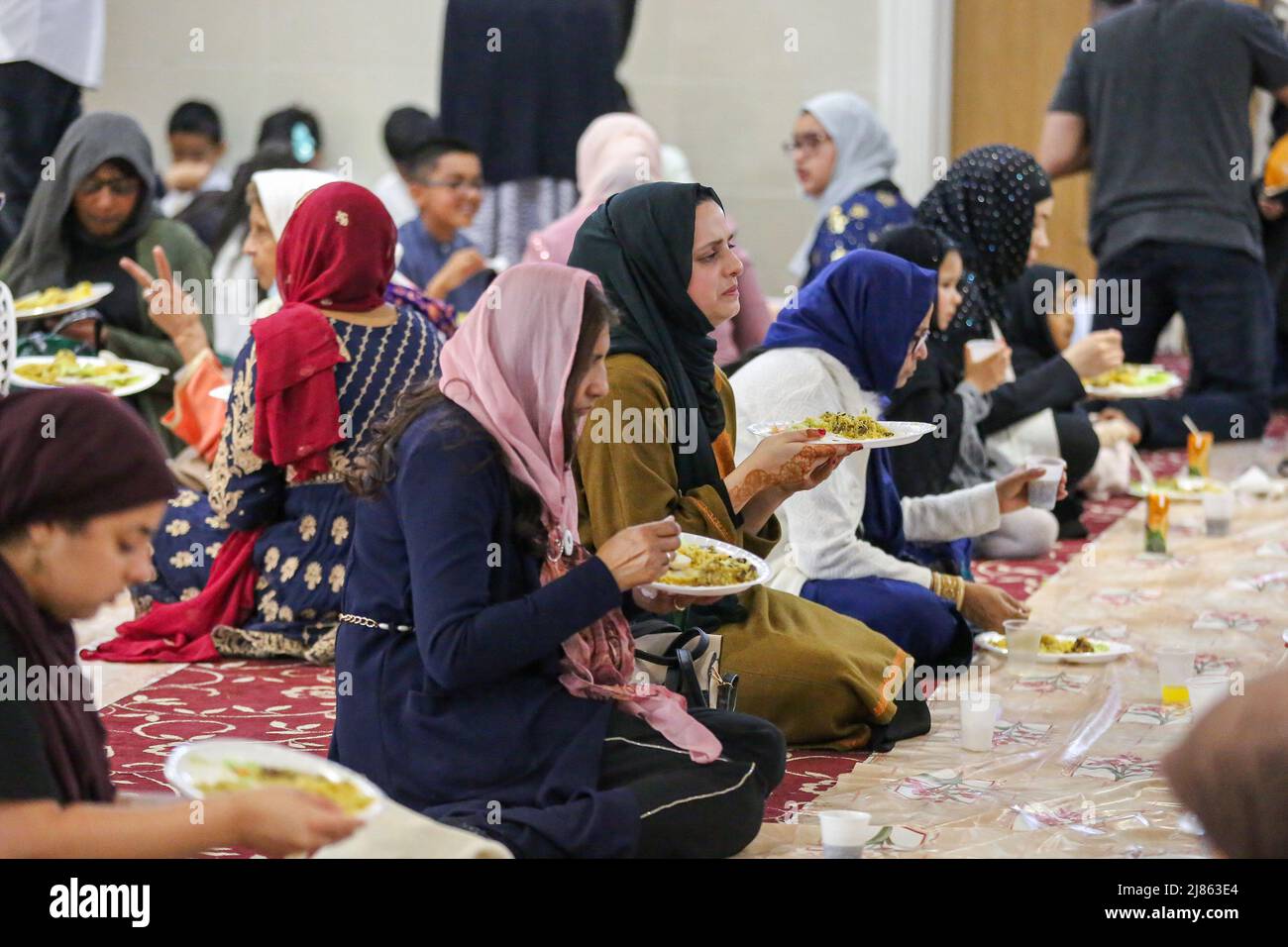 Muslim women seen eating after prayers at a mosque Stock Photo - Alamy