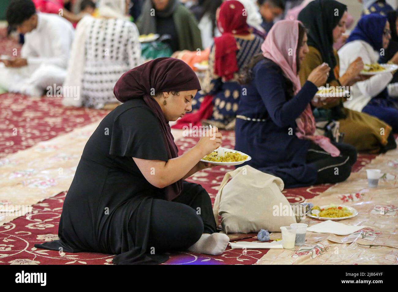Muslim women seen eating after prayers at a mosque. (Photo by Dinendra ...
