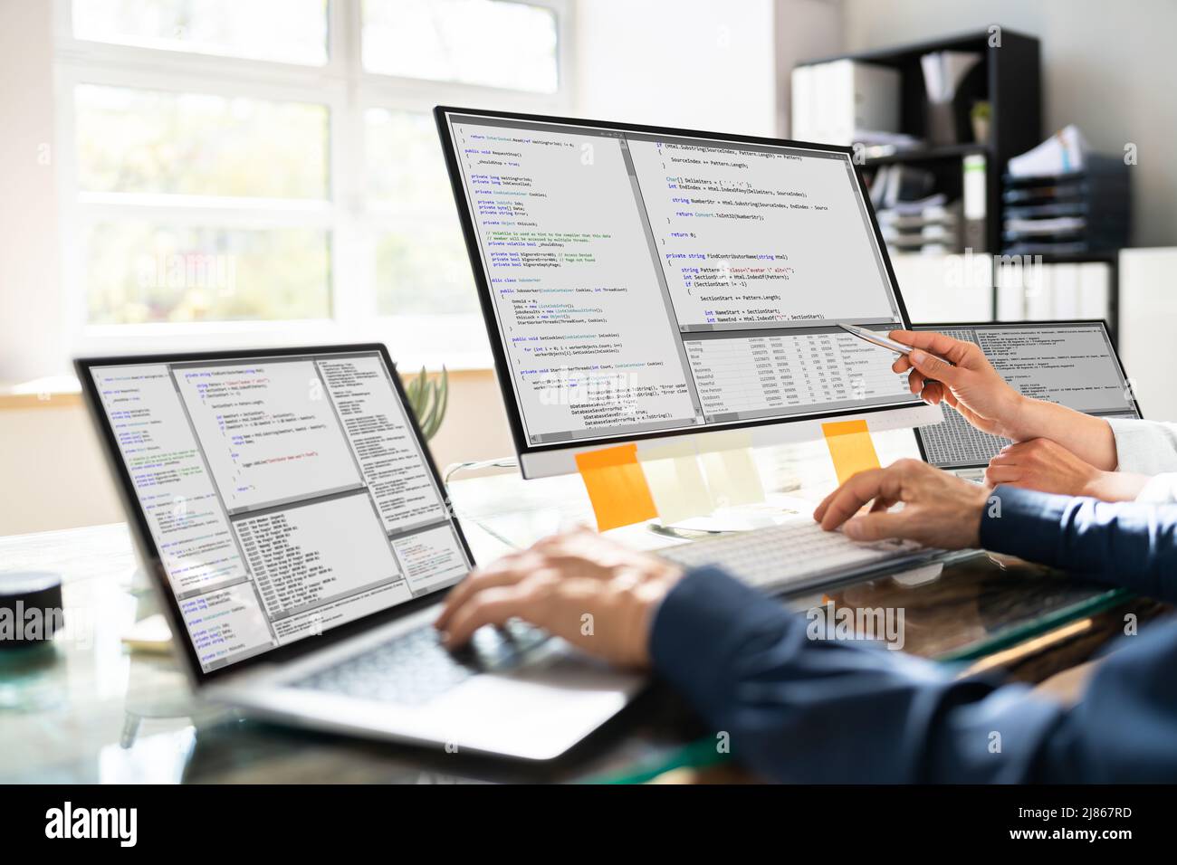 Coder typing programming language hi-res stock photography and images ...