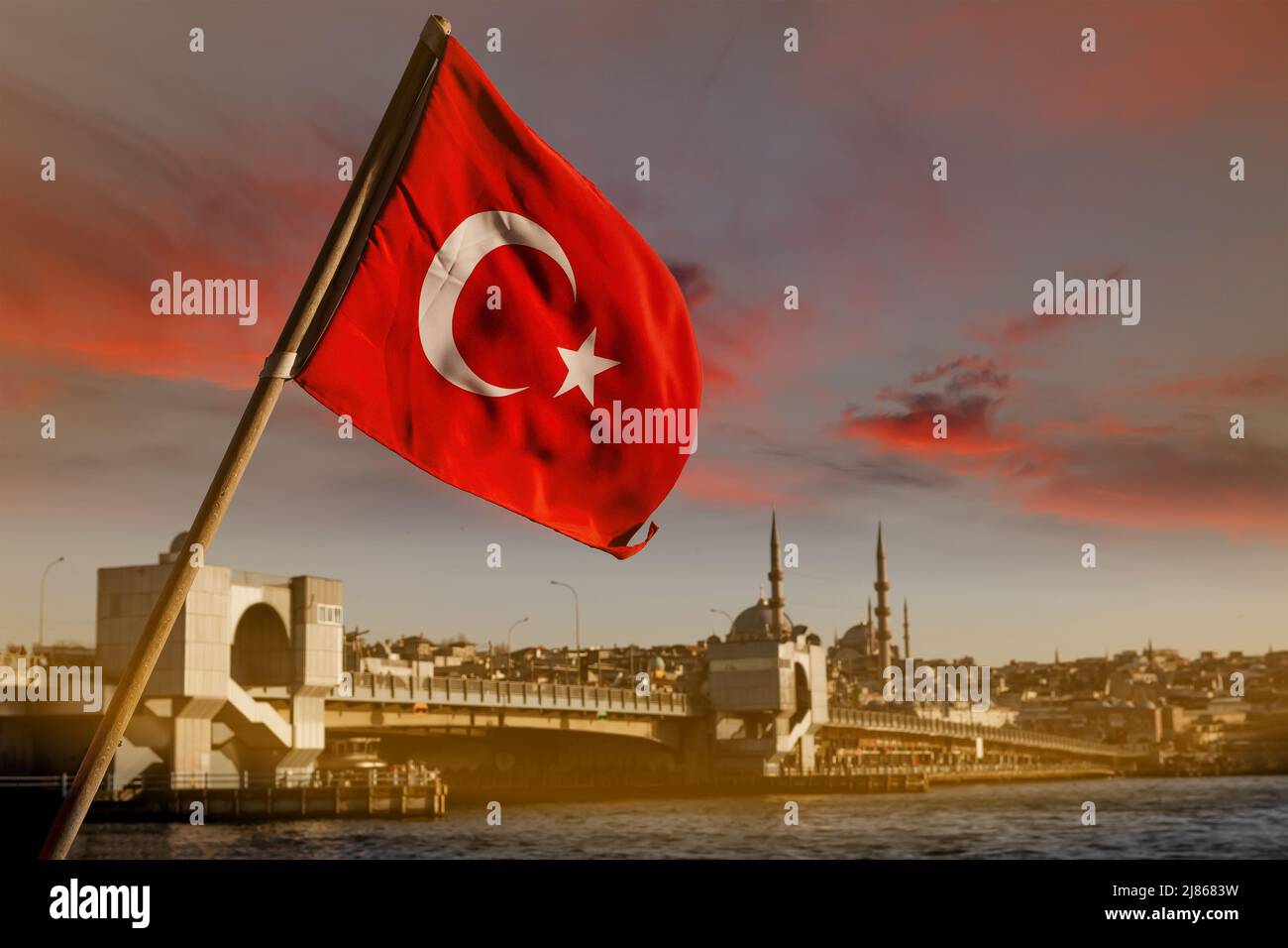 The Turkish flag is waving over the Istanbul Galata Bridge and ...