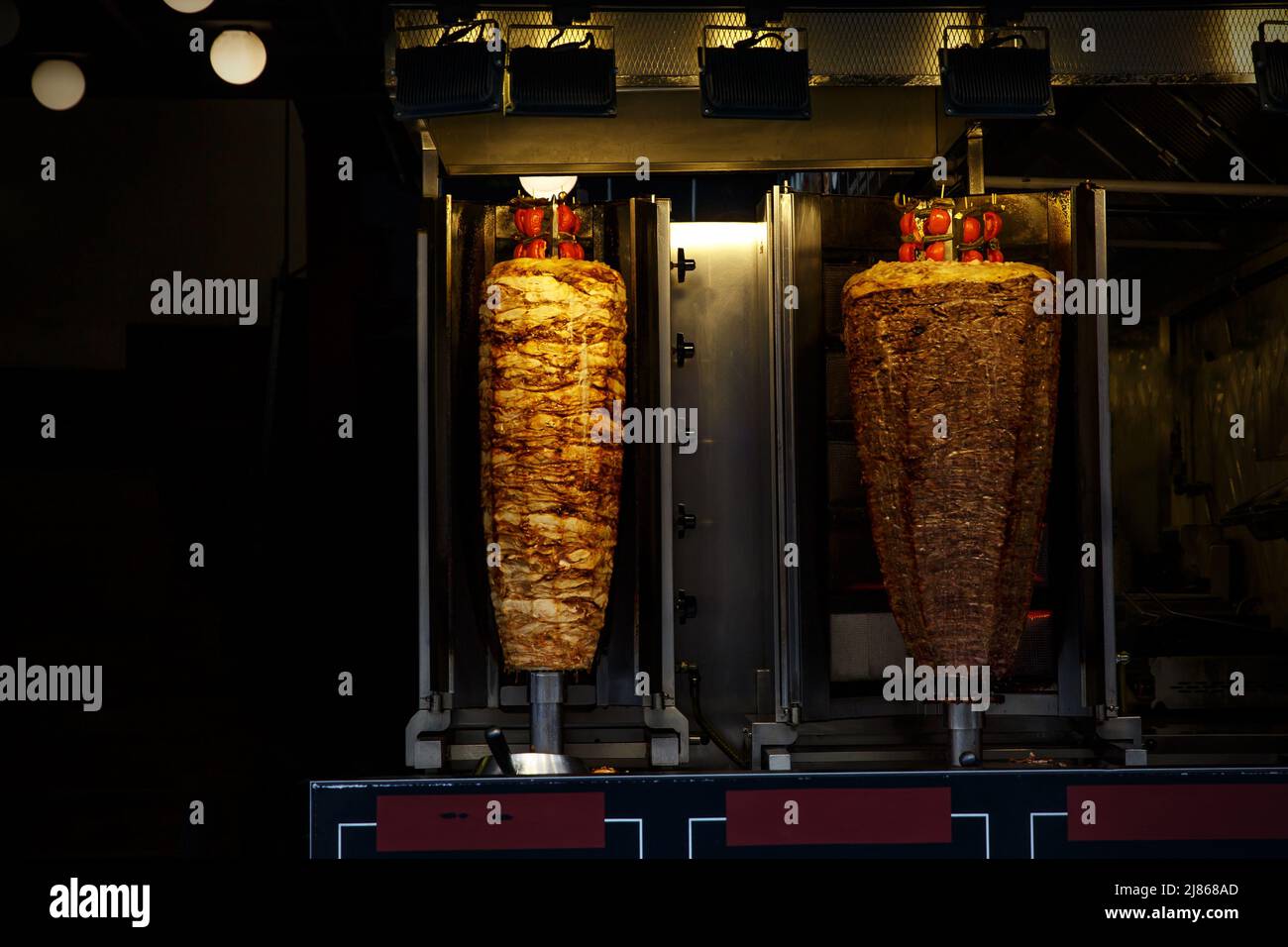 Traditional Turkish food Doner Kebab. Two rolls of chicken and beef ...
