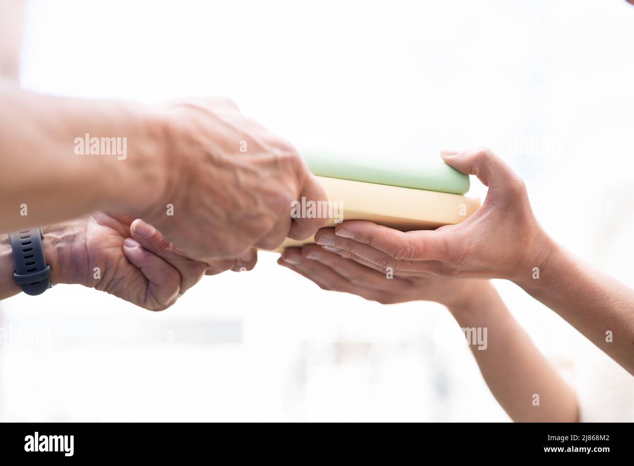 Female student lending book hi-res stock photography and images - Alamy