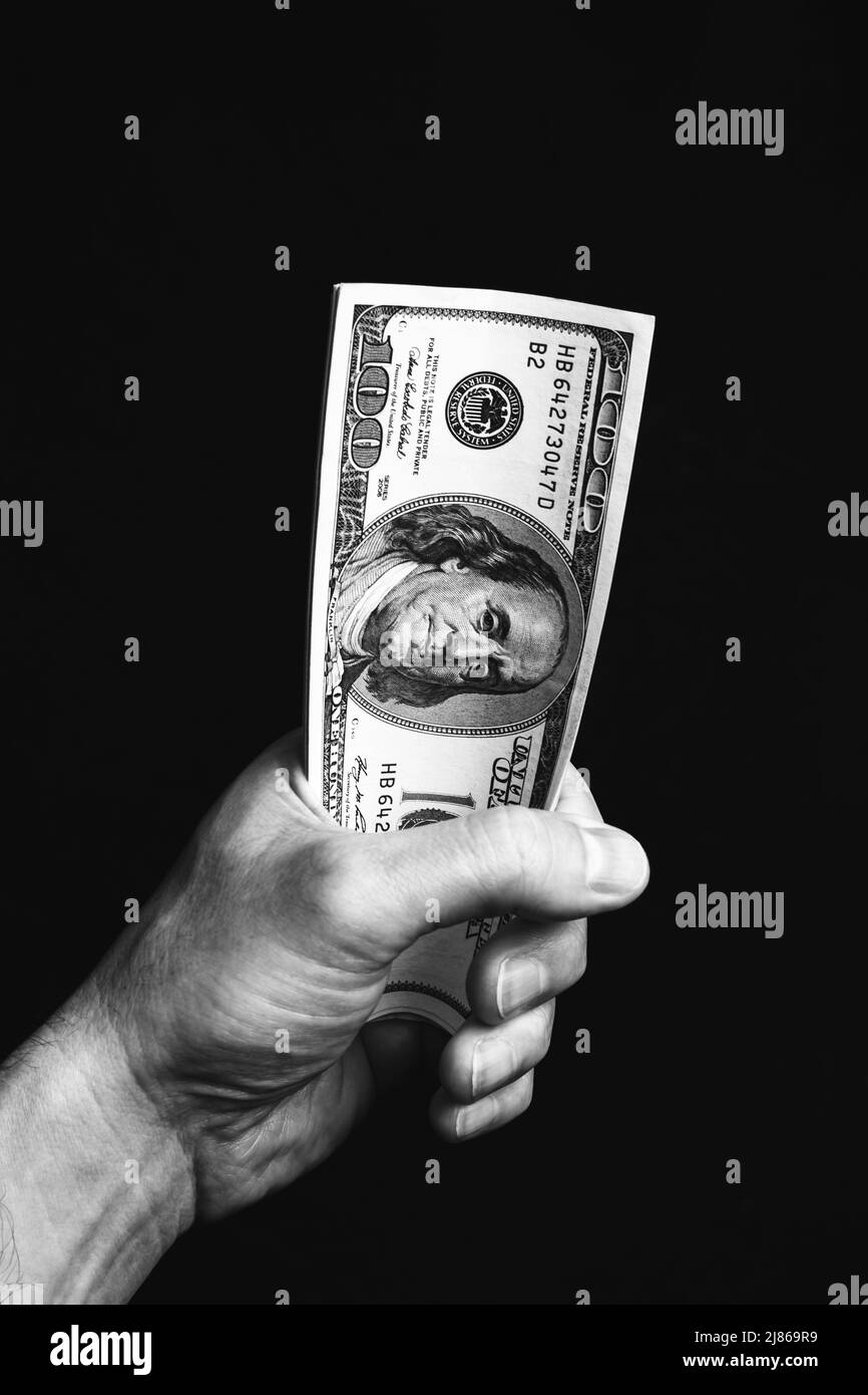 Black Hands Holding Money