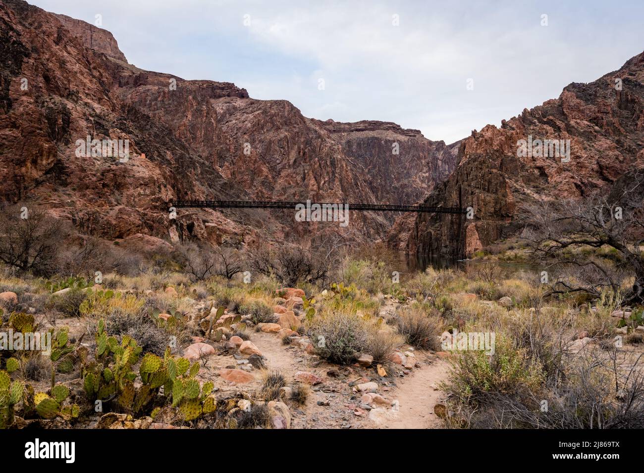 Black Bridge Connects The Two Sides of The Grand Canyon near the Bright ...