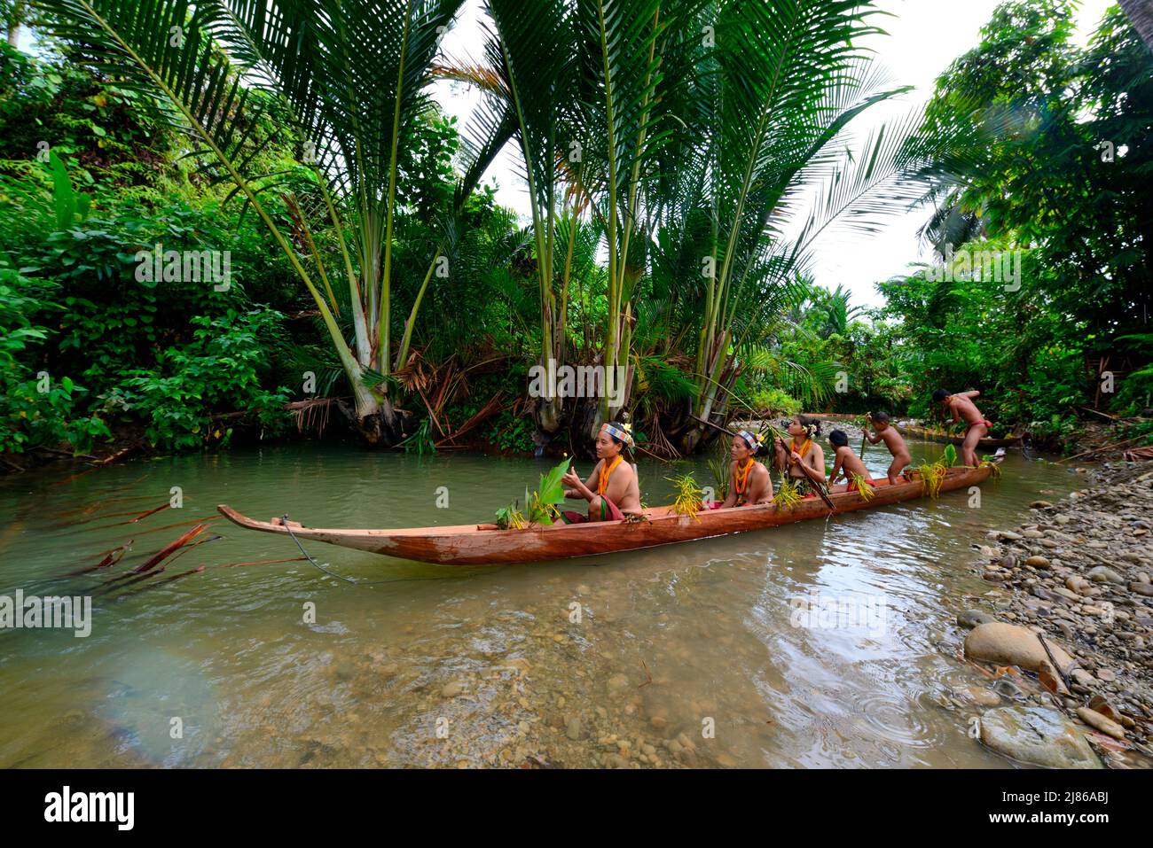 Women and children Mentawai in dugout Siberut island, Indonesia Stock ...