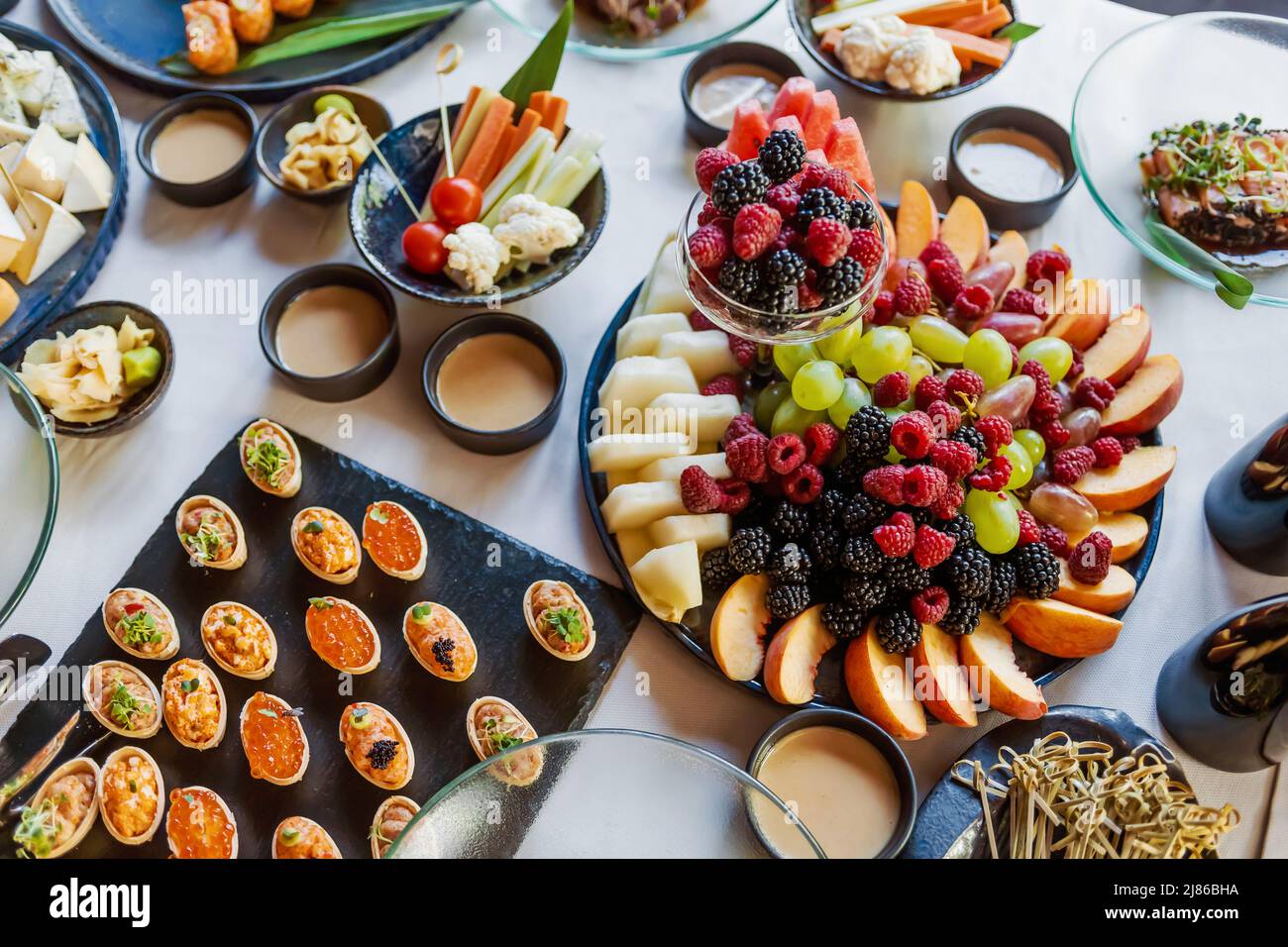 Various appetizers on the festive table Stock Photo - Alamy