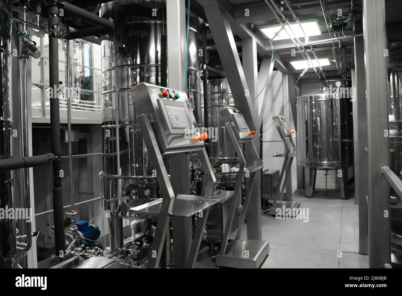 Equipment control station. Factory interior, steel pipelines, tubes ...