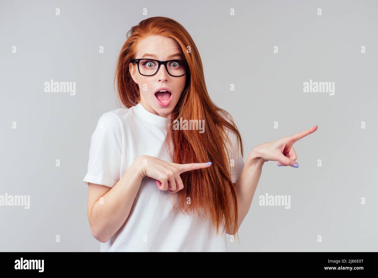 redhaired ginger woman feeling happy ,wearing white cotton t-shirt in ...
