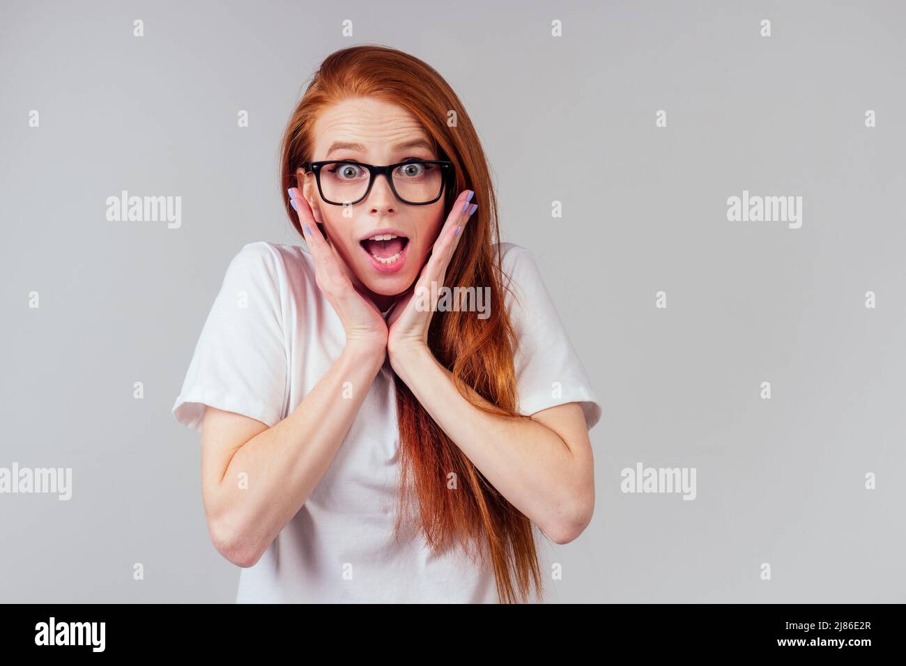 redhaired ginger woman feeling happy ,wearing white cotton t-shirt in ...