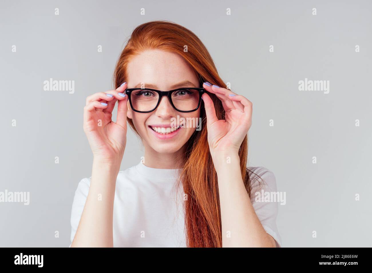 redhaired ginger woman feeling happy ,wearing white cotton t-shirt in ...