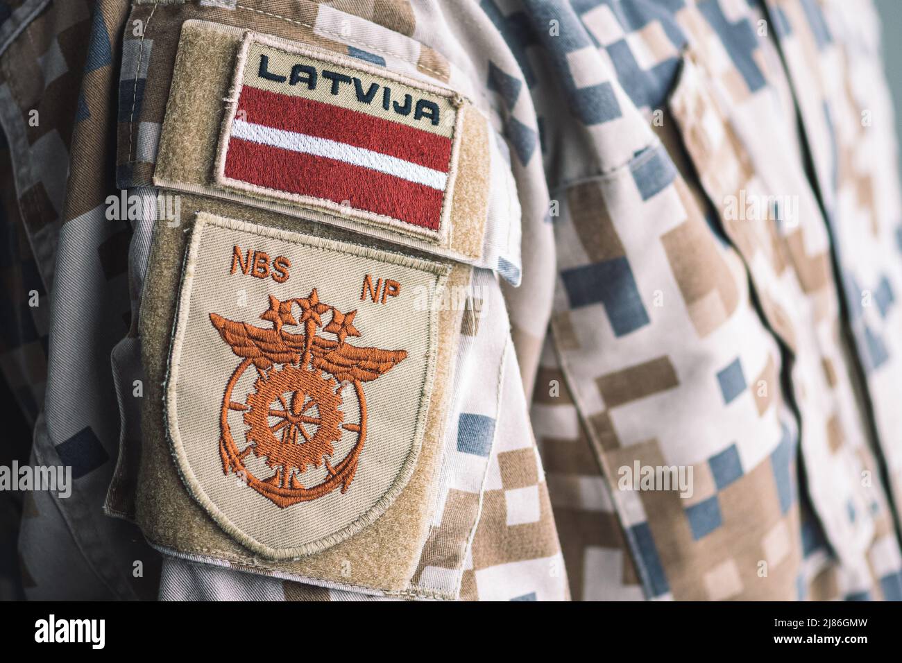 Latvian National Armed Forces with flag of Latvia and emblem of Support ...