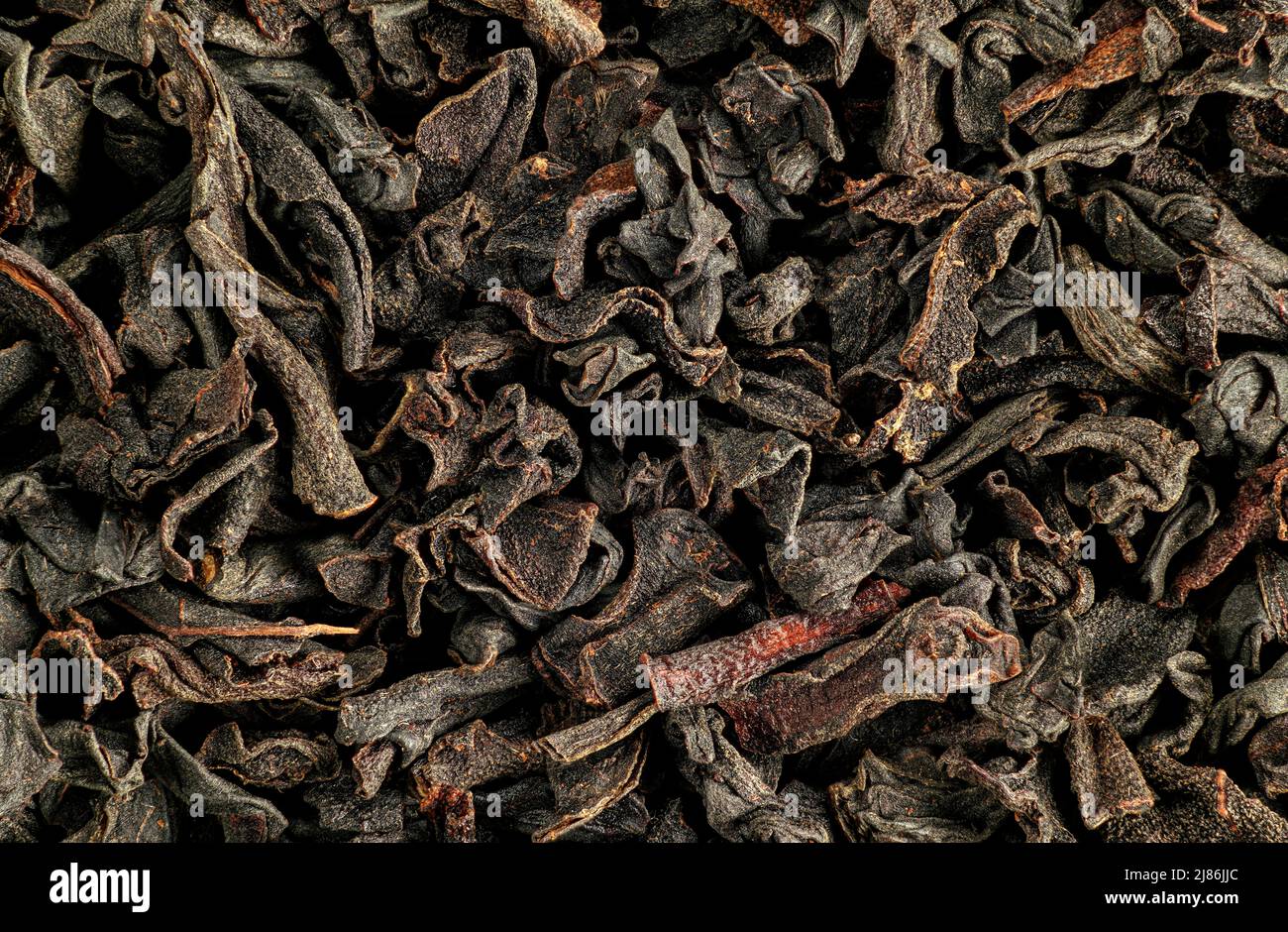 Black loose leaf tea - India variety. Dry leaves under 1.5x ...