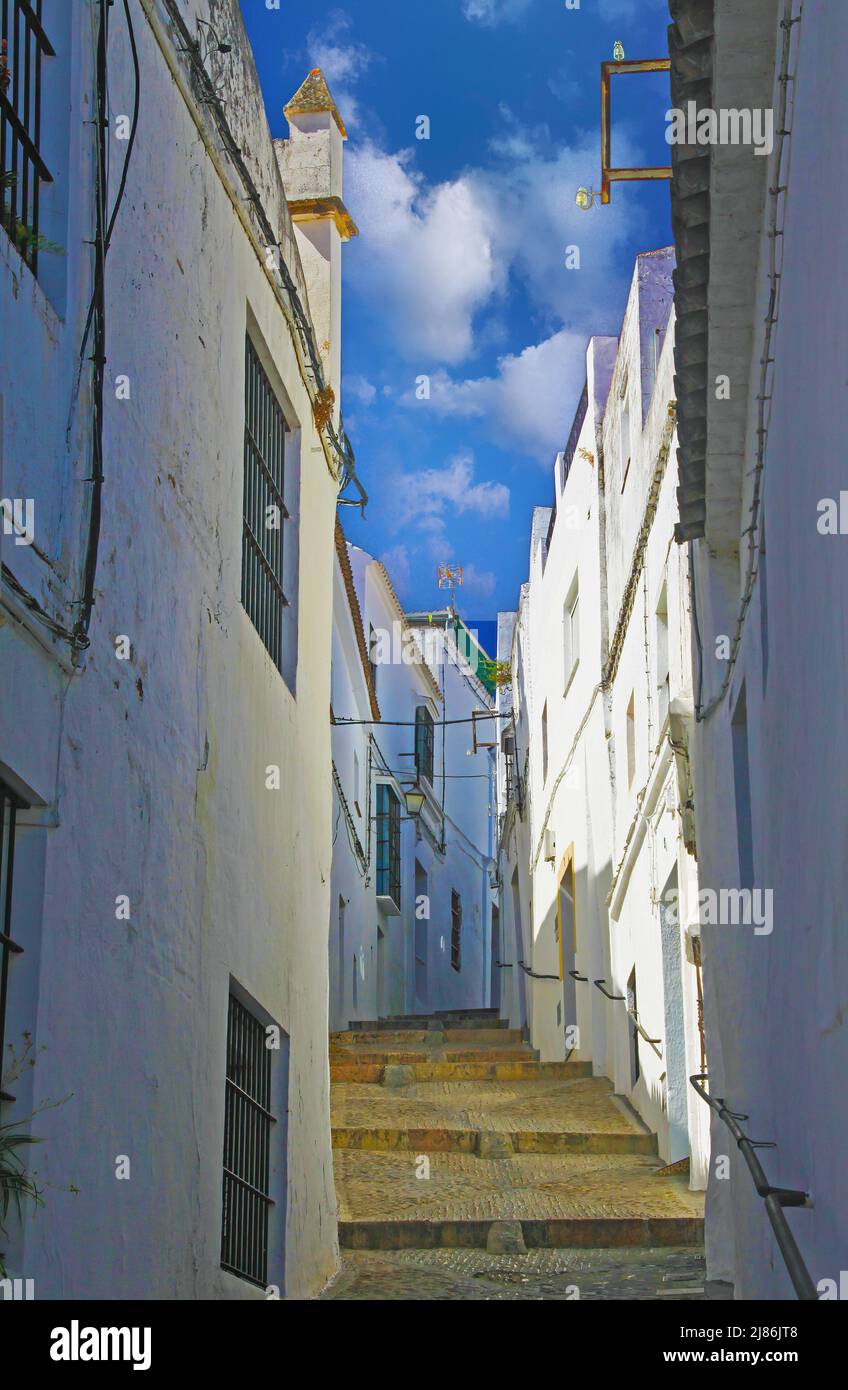 Beautiful traditional andalusian white village, empty lonely alley with ...