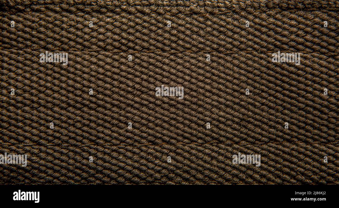 Close-up texture of a canvas fabric backpack. Leather straps and metal ...