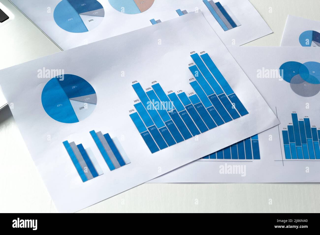 Financial charts and reports on the desktop. Statistical data on paper ...