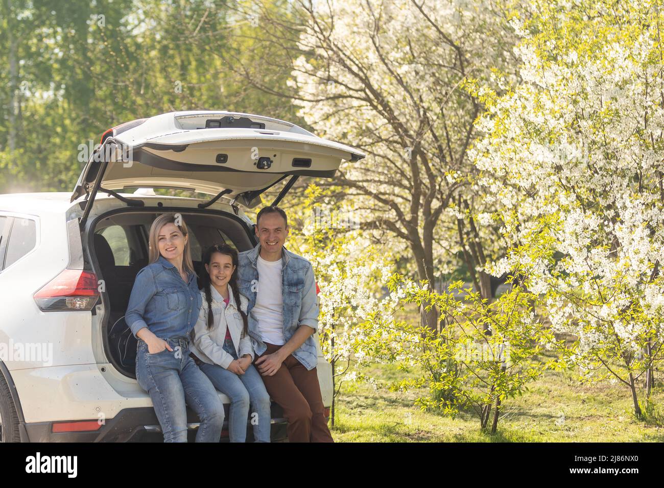 Travel car and camping luggage packed in the full car trunk. Outdoor ...