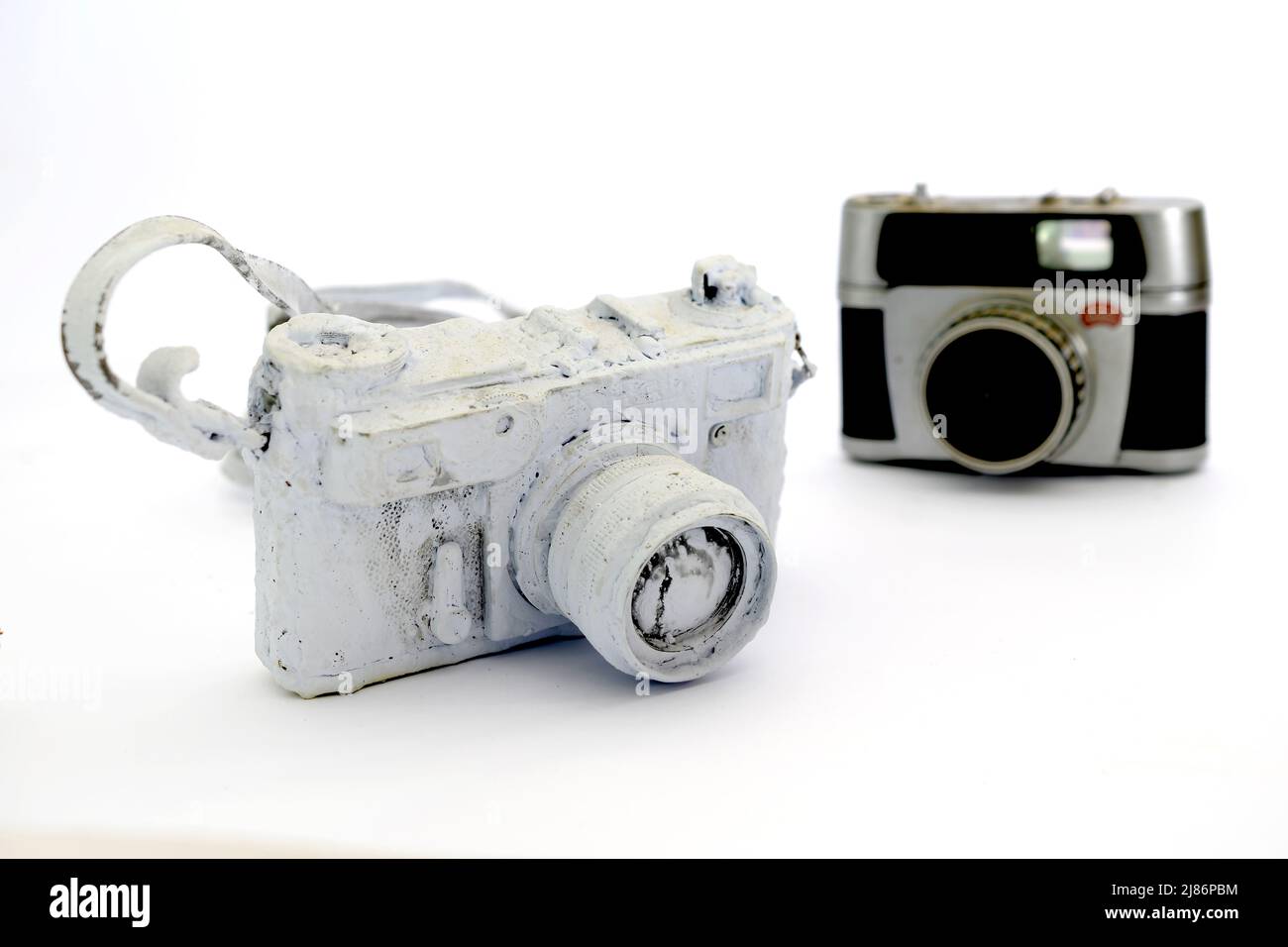 Old camera painted with wall paint color Stock Photo - Alamy
