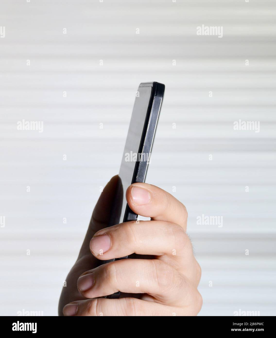 cell phone in a man's hand Stock Photo - Alamy