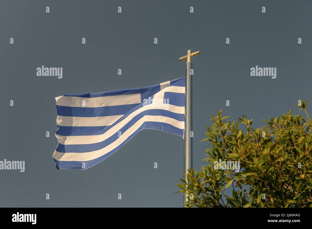 Greek national flag with cross closeup on church in Paphos, Cyprus ...