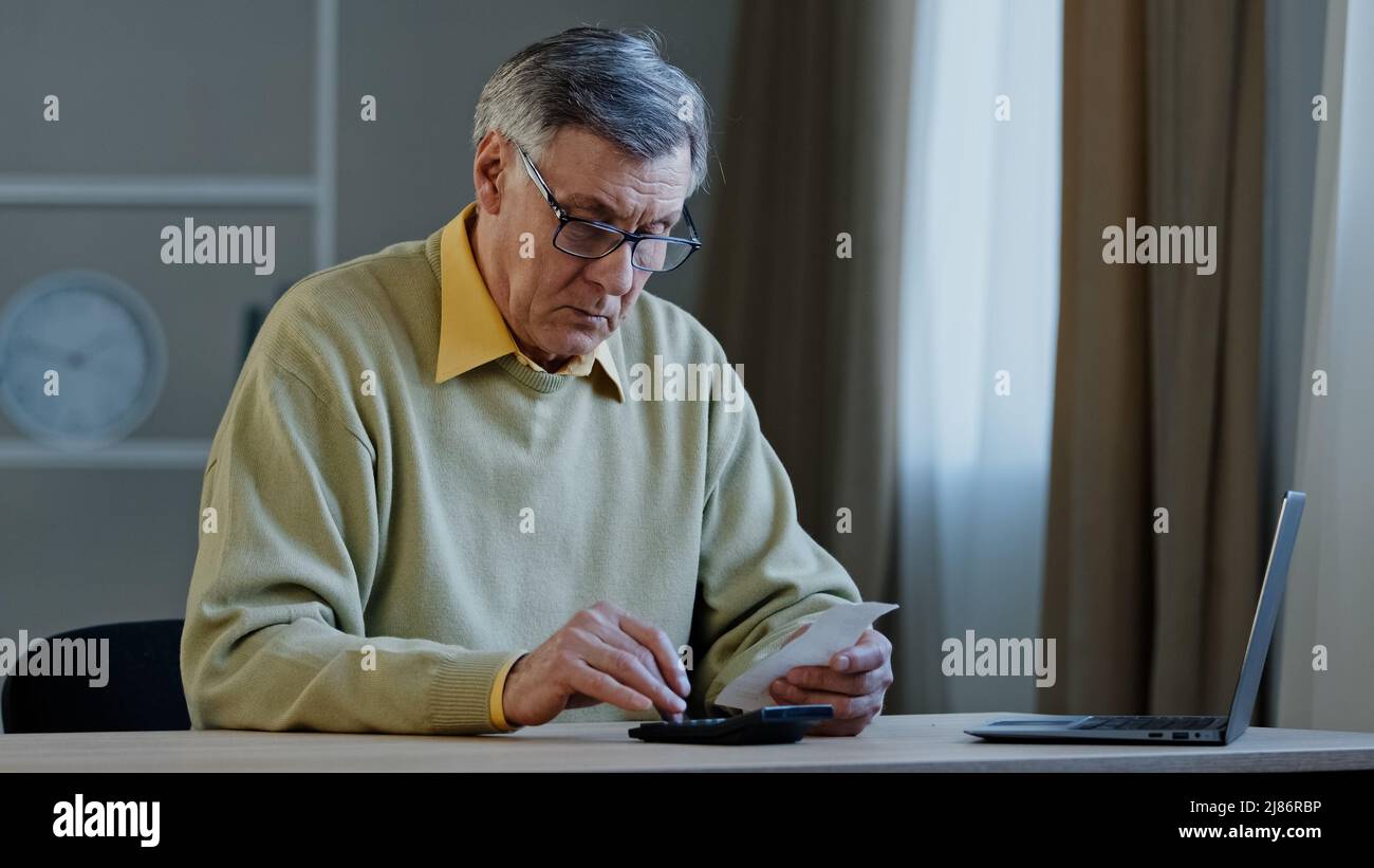 Elderly man checking utility bills hi-res stock photography and images ...