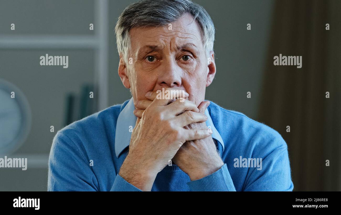 Depressed desperate old senior Caucasian man shocked sad elderly mature ...