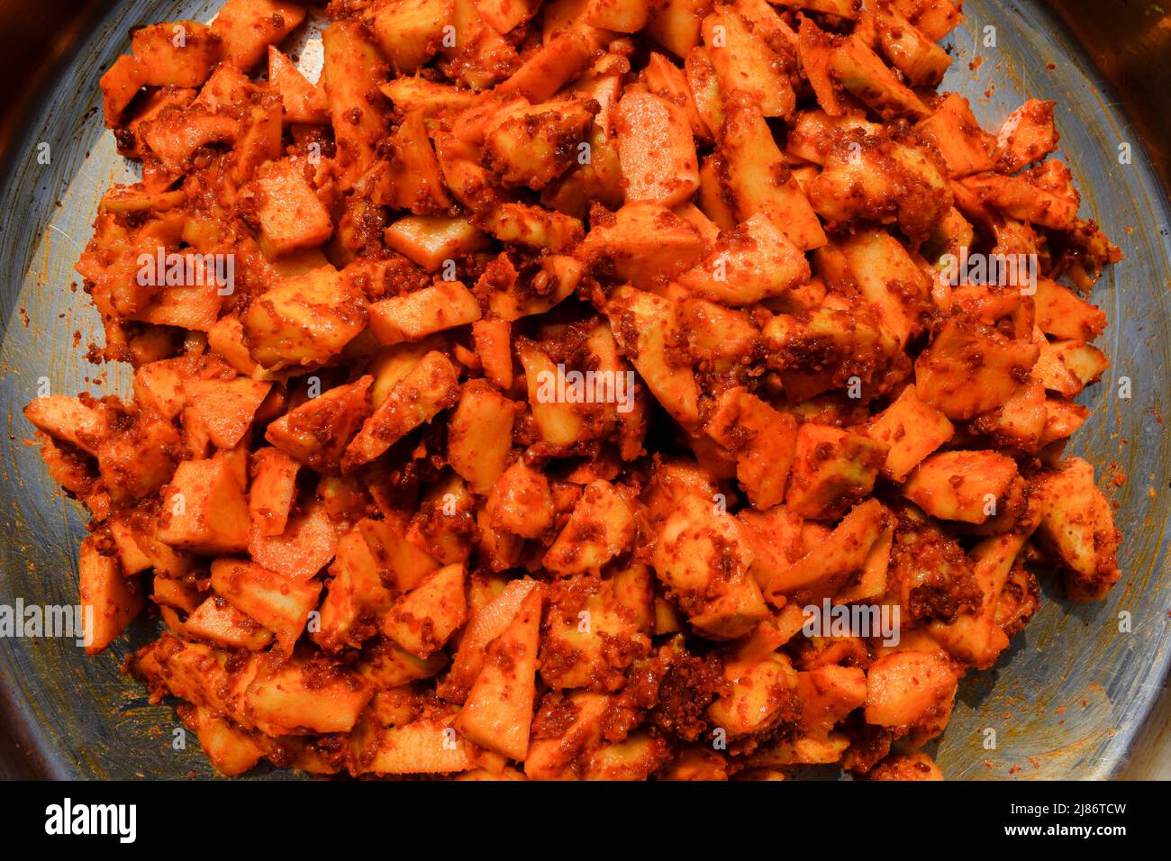 Tasty Indian Mango pickle preparation at home. Homemade Mango pickle or ...