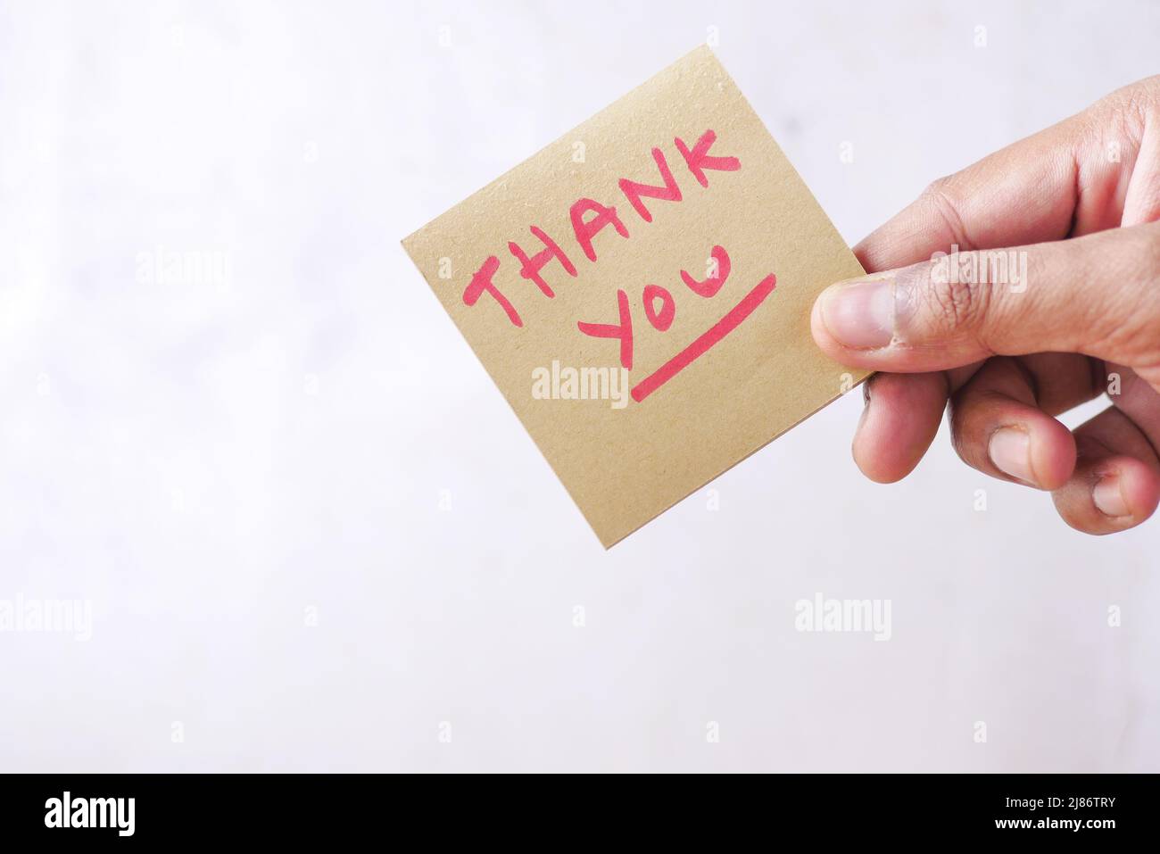 hand holding thank you note with copy space Stock Photo - Alamy