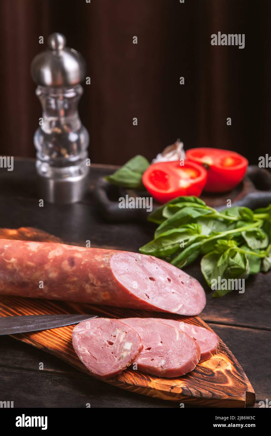 Still life with homemade duck sausage, boiled and smoked Stock Photo ...