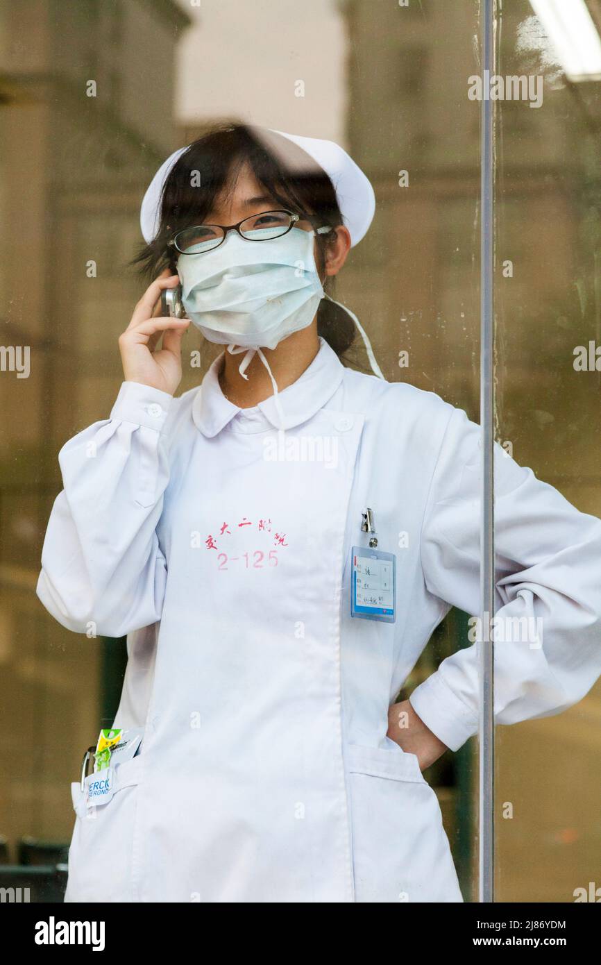Nurse female medical staff speaking and talking on the telephone, a ...