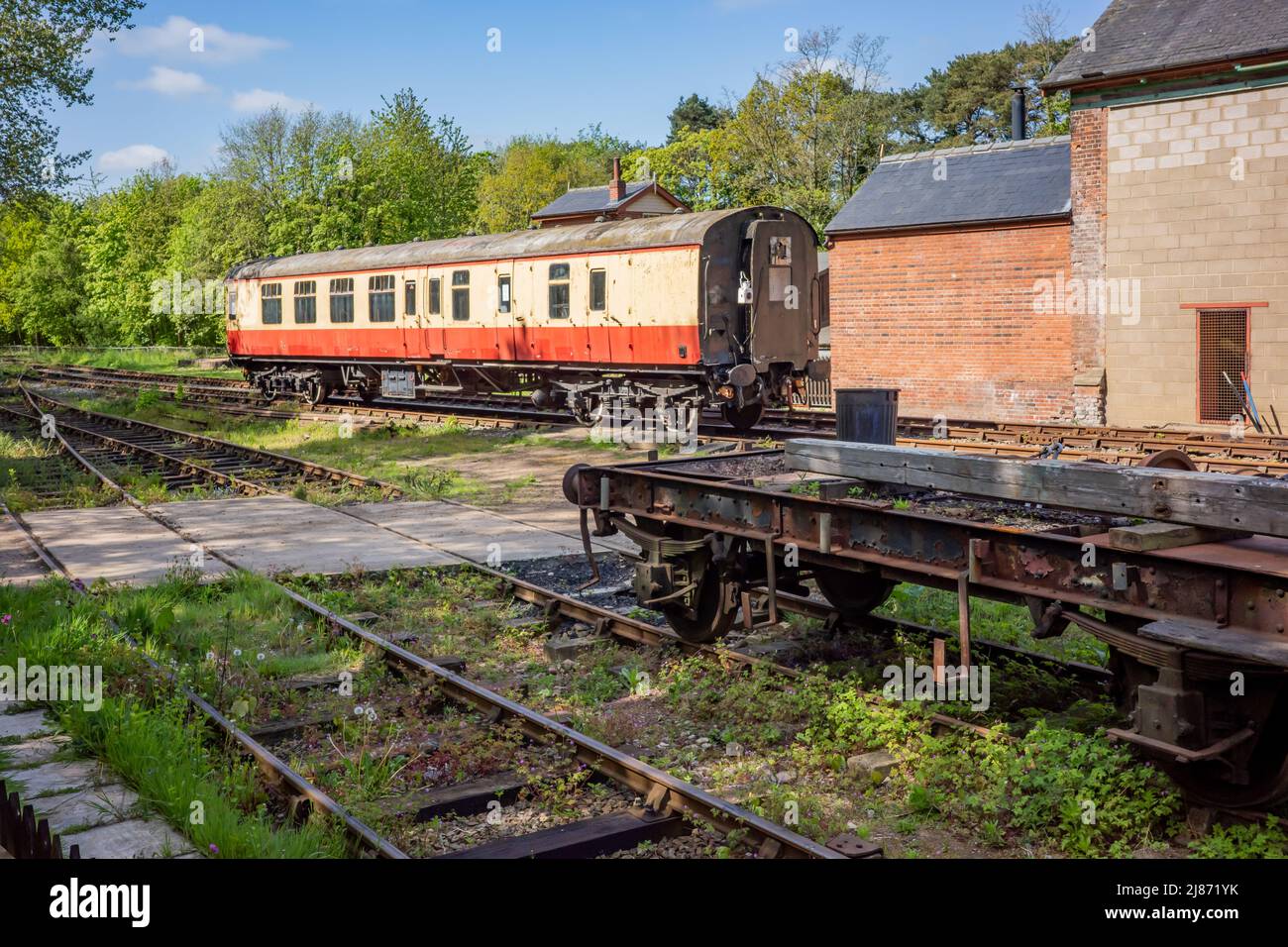 old and abandoned railway carriages and rail industry equipment in a ...