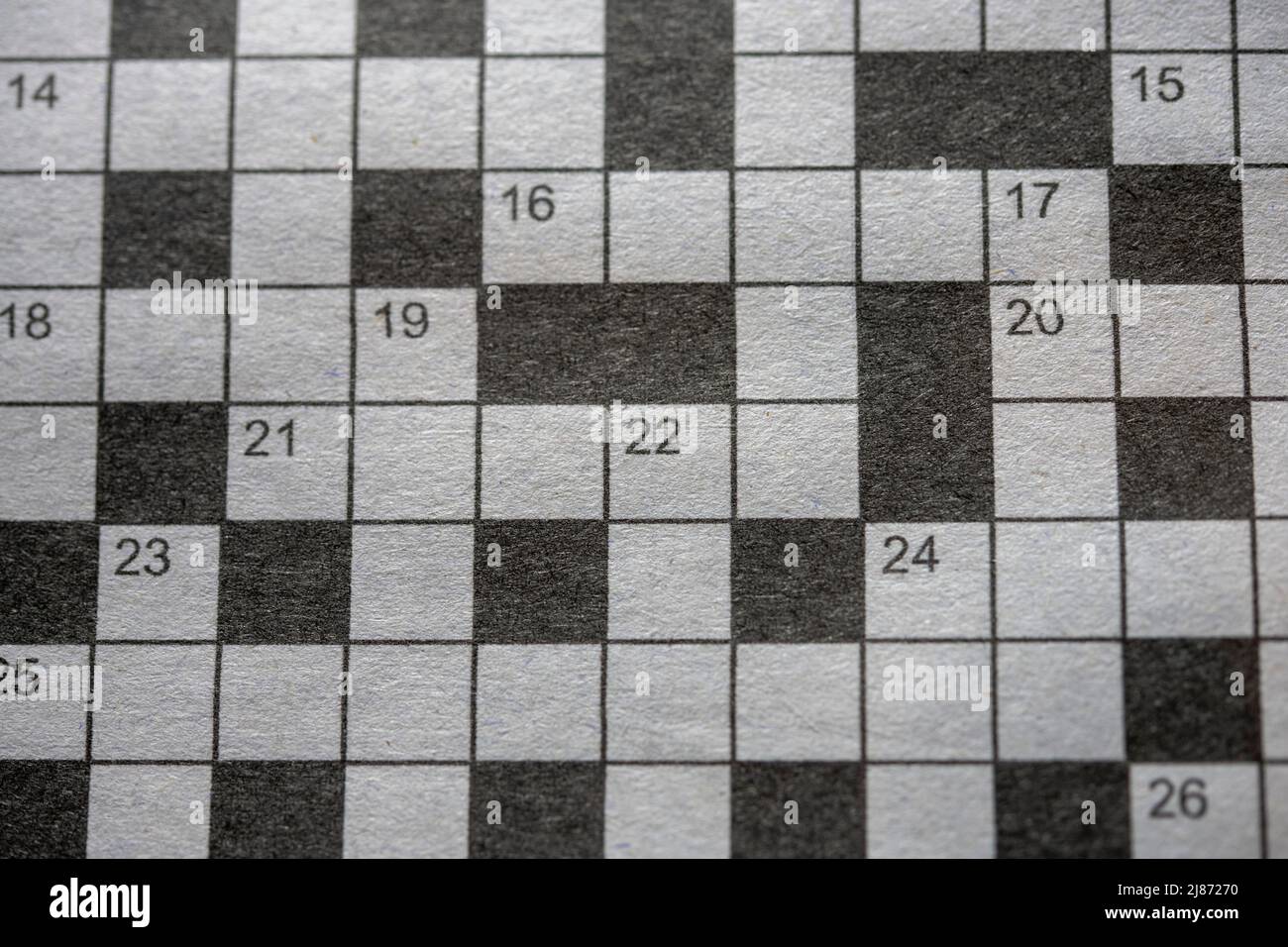 Crossword puzzle on grayscale newspaper Close up Stock Photo - Alamy