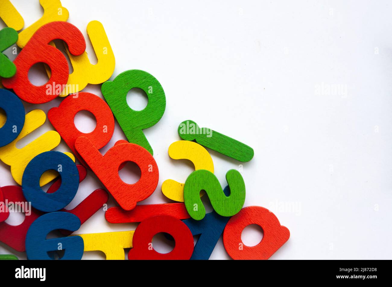 Wooden color letters on white background. Copy space Stock Photo - Alamy