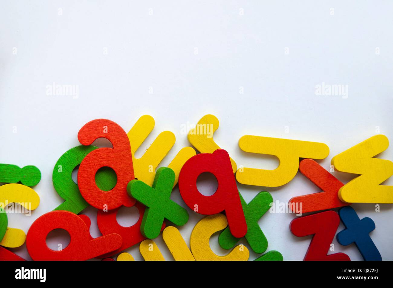Wooden color letters on white background. Copy space Stock Photo - Alamy