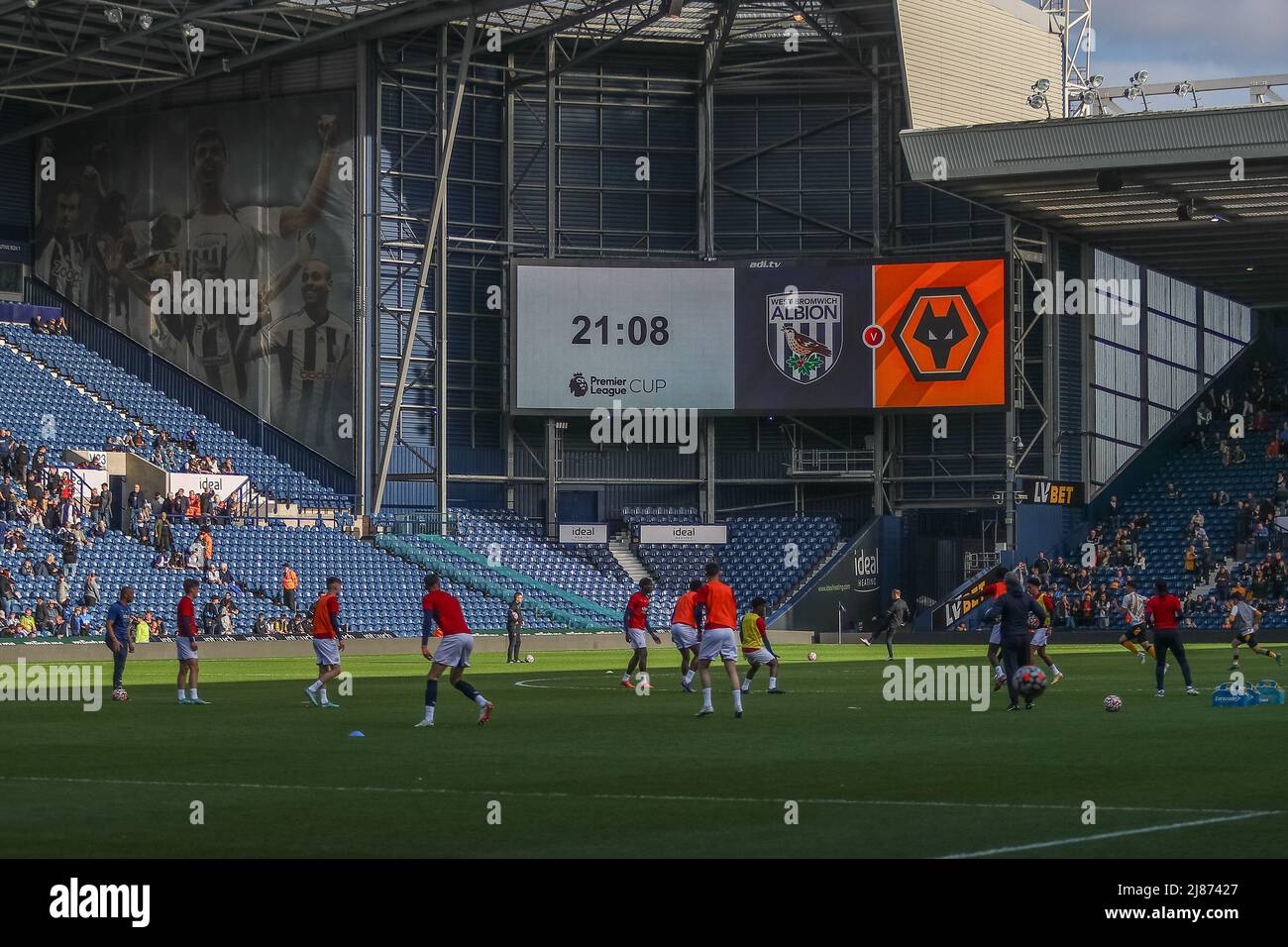 A general view of the teams warming up with the countdown to kick off ...